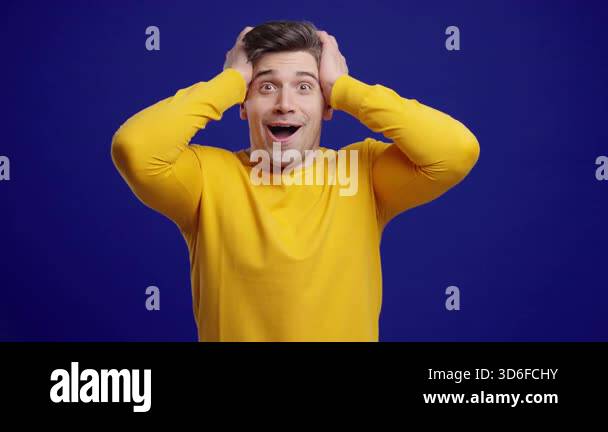 Impressed man shocked, saying WOW. Handsome man surprised to camera ...