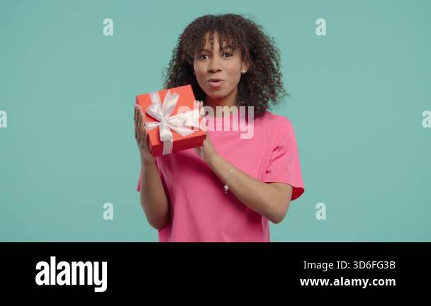 Happy stylish african american woman gift box on Blue background. Lady ...