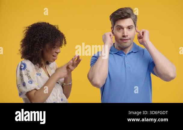 Frustrated couple in studio conflict. Woman shouts emotionally while ...