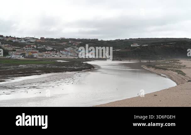 River mouth flowing to the Atlantic Ocean with hillside houses and ...