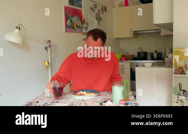 white man at breakfast table sipping tea, retiree pausing for quiet ...