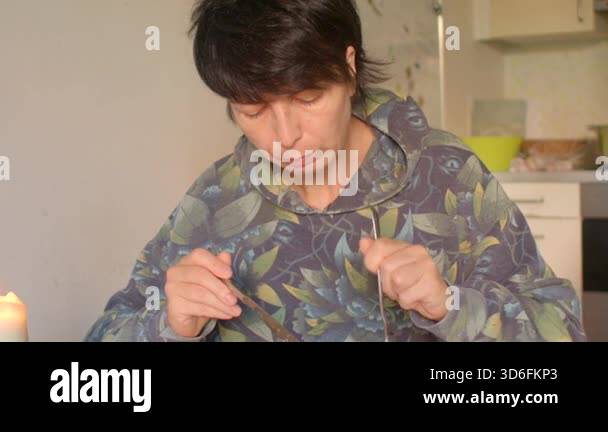 woman recording taste reaction at kitchen counter, expressive face and ...