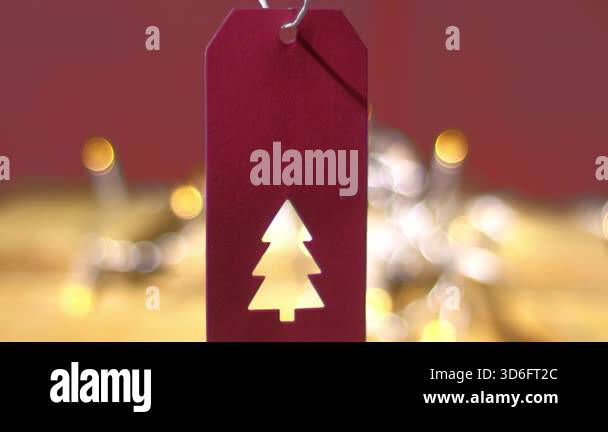 Christmas gift tag with festive lights twinkle background 4k super slow ...