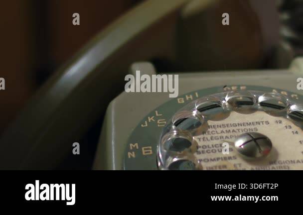 Vintage rotary dial phone close up super slow motion selective focus ...