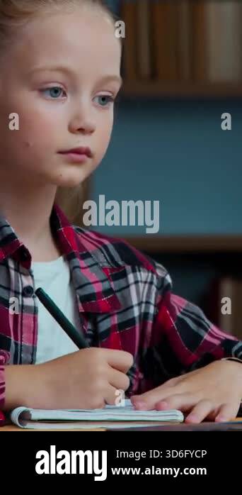 Caucasian concentrated daughter child kid girl studying online from ...