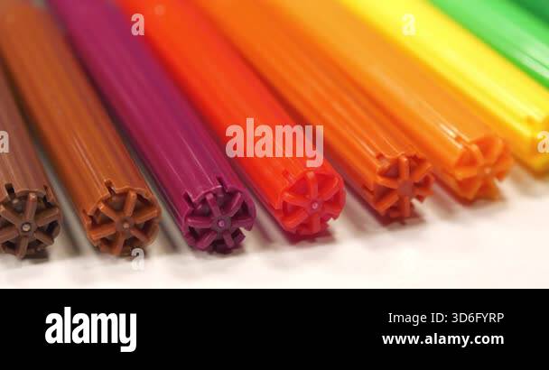 Many-coloured felt-tip pens lies on white table. Multicolored felt-tip ...