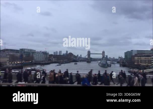London, UK - January 2025: Stock video footage of rush hour commuters walking over Waterloo ...