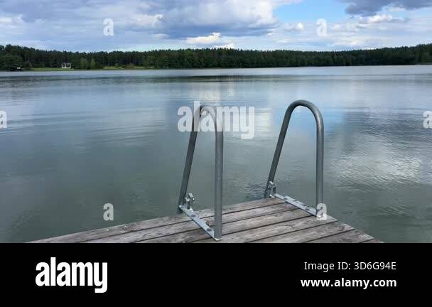 Empty Boat Dock On The Lake For Waterfront Home In Lithuania. High ...