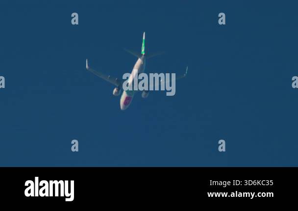 Cannes, France - October 11, 2025: An airplane passes overhead in a ...