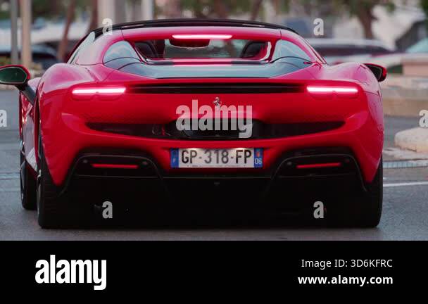 Cannes, France - October 9, 2025: A red Ferrari sports car captured ...