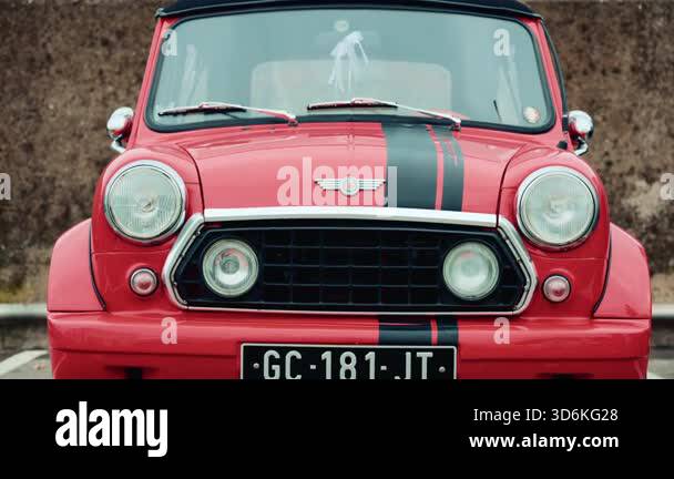 Cannes, France - October 20, 2025: Frontal view of a vintage red Mini ...