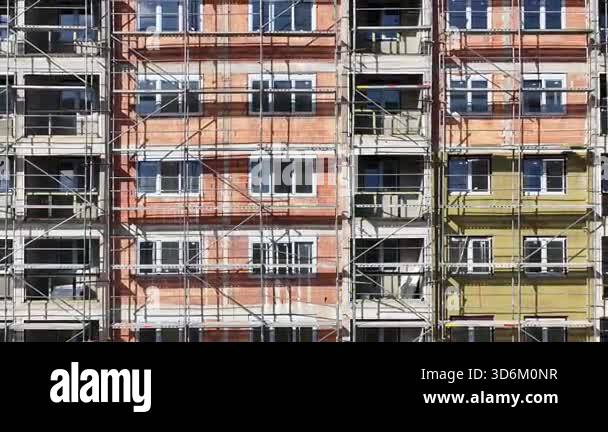 Aerial drone video of residential building facade under renovation ...