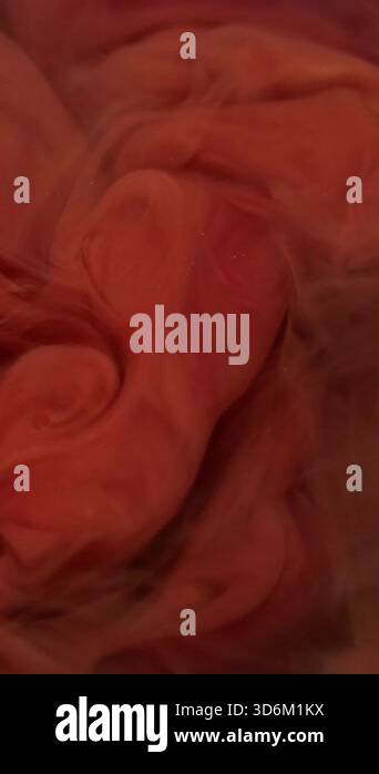 Vertical video. Blend ink. Fume water. Defocused pink purple orange ...