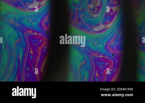 Neon oil mix. Ink spill. Color fluid blend floating green purple blue ...