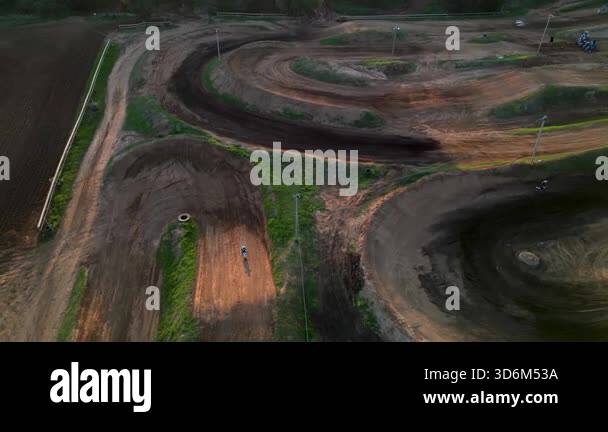 Aerial drone view of a motocross race track circuit with motorcycles ...