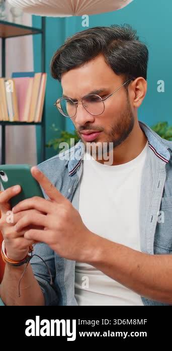 Happy man use mobile smartphone typing browsing say Wow yes ...