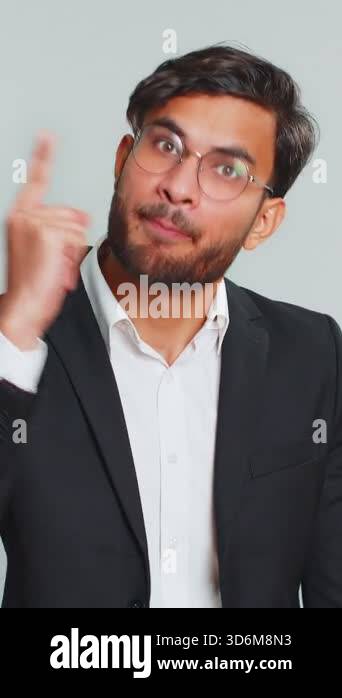Indian businessman shakes finger and saying no, be careful, scolding ...
