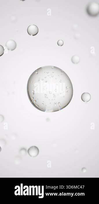 Macro of transparent drop of liquid with bubbles inside on white ...