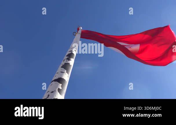 Monastir, Tunisia A red Tunisian flag flutters in the wind on a ...