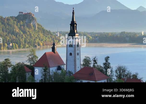 Aerial view of Lake Bled at sunrise in autumn, Slovenia. Pilgrimage ...
