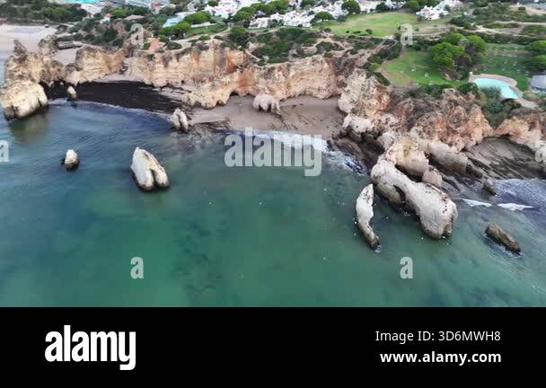 Drone Aerial view of beautiful Praia dos Tres Irmaos beach during ...