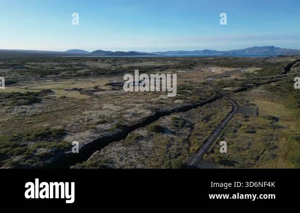 Plate Fault. A large crack in the ground is visible in the middle of ...