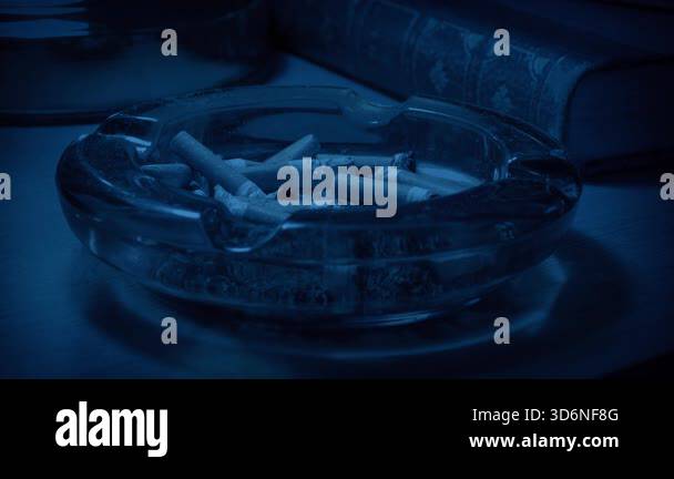 Cigarette Put Out In Ash Tray In Dark Room Stock Video Footage - Alamy
