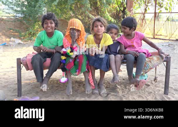 PUSHKAR, INDIA - NOVEMBER 17, 2018 : Indian poor children in the desert ...