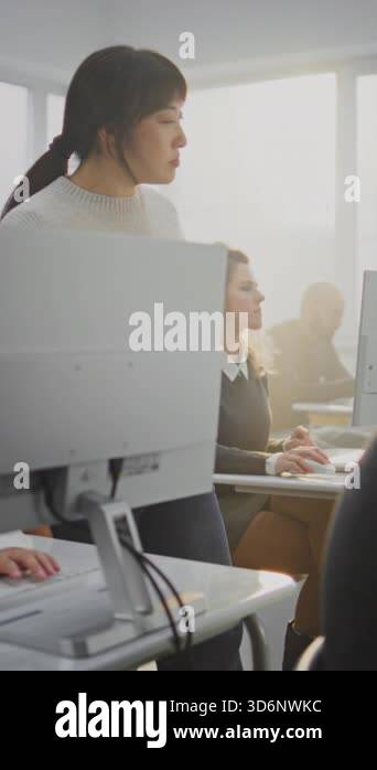 Teacher Assists Senior Student With Computer Project in Modern ...