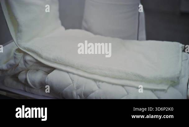 Close Up of Maid in Uniform Attentively Sorting and Folding Towels on ...