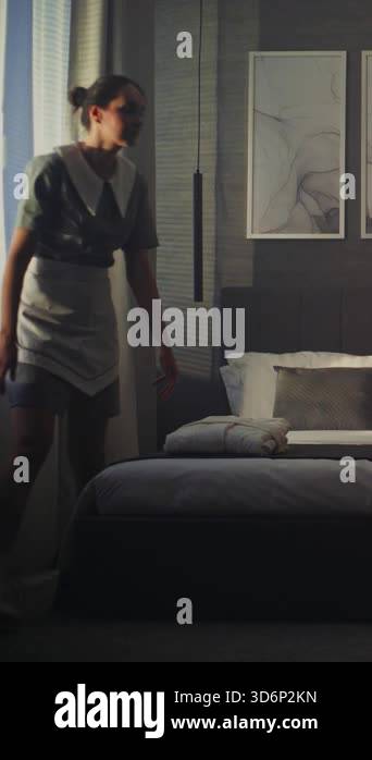 Female Hotel Employee Enters Dark Suite Refresh Room, Emphasizing ...