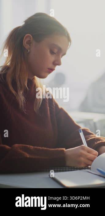 Teenagers Writing Completing Task in Classroom. Diverse Group of ...