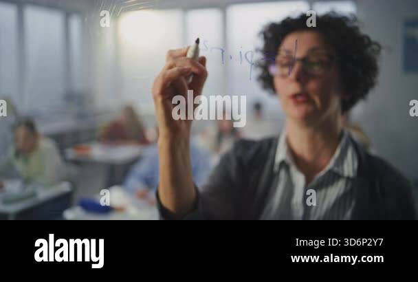 Dynamic Female Teacher With Glasses Writes With Marker Formulas ...