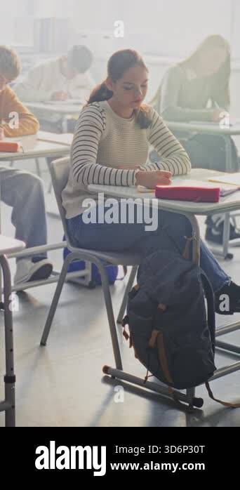 Students Writing Exam In Bright, Modern Classroom. Group of Pupils Sits ...