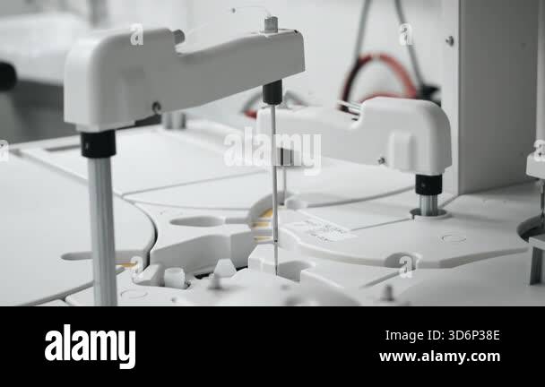 Close up view of automated laboratory analyzer system performing sample ...