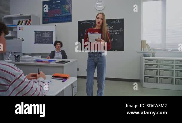Attractive Teenage Girl With Long Hair Giving Presentation In Modern ...