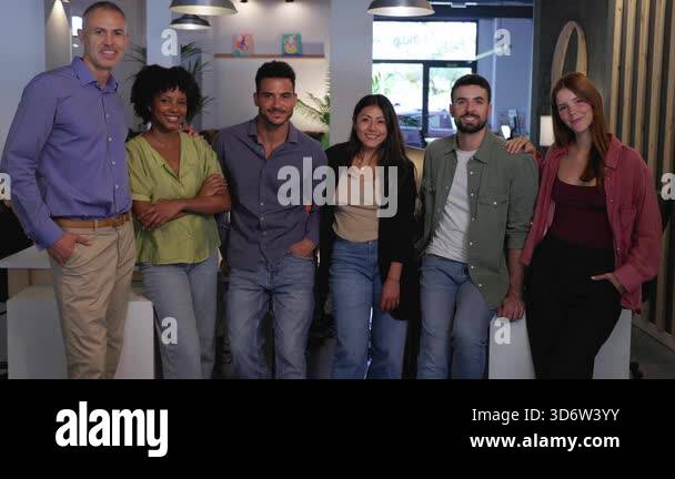 Portrait of diverse coworkers standing together in modern office. Group ...