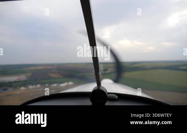 Pilots view from cockpit as aircraft propeller spins rapidly ...