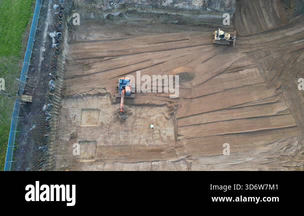 Earthworks scene showcasing heavy machinery in action, with a focus on ...