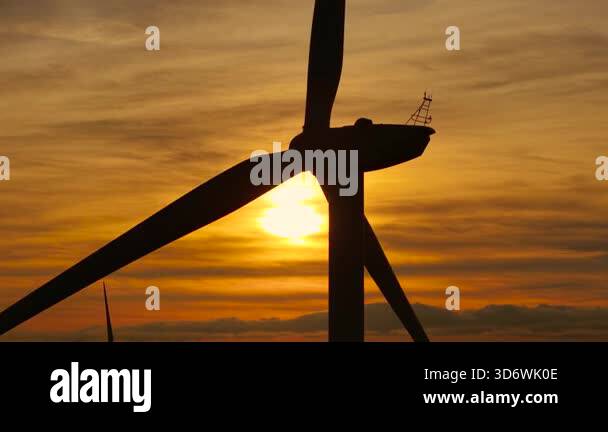 Turbine spinning in golden hour light. Creating electricity with ...