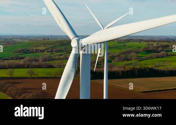 Drone aerial view of Wind Farm featuring large wind generator turbines ...