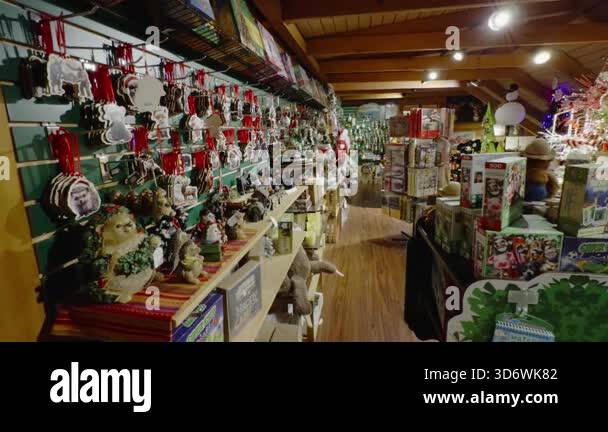 Cozy Christmas shop interior, filled with holiday decorations, Santa ...
