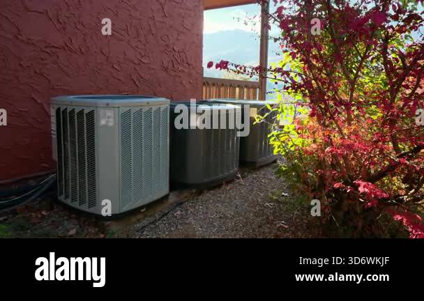 Home HVAC Air Conditioner system outside the house. Bright autumn sunny ...