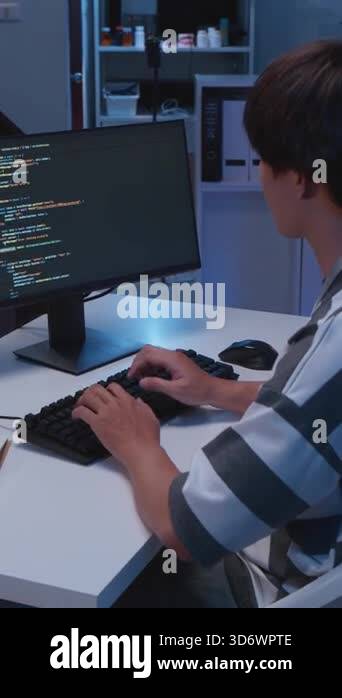 One young male Asian IT freelancer programmer and tech engineer working ...