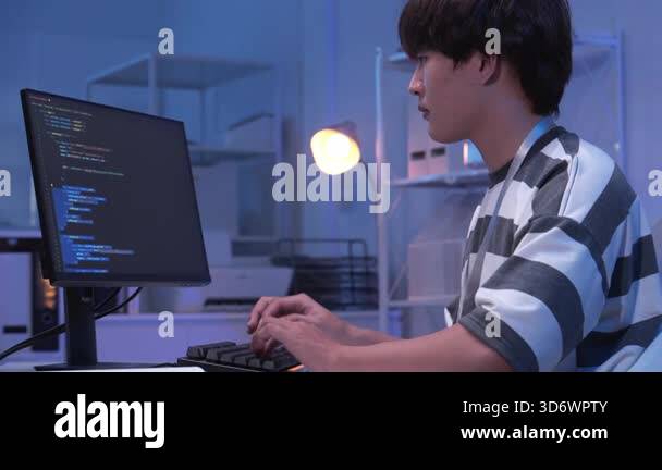 One young male Asian IT freelancer programmer and tech engineer working ...