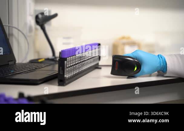 Lab Technician Scanning Barcode of Blood Tubes in Laboratory Stock ...