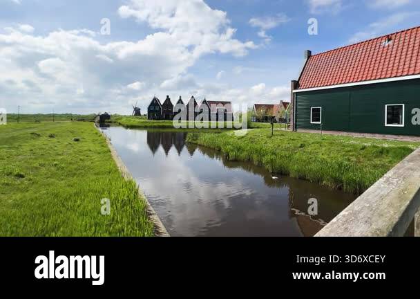 rural dutch country street of small old town Volendam, Netherlands ...