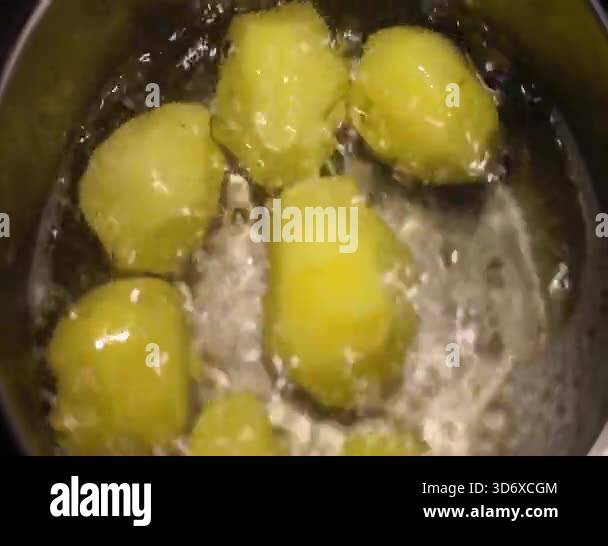 Peeled potatoes in boiling water. cooking dinner lunch family food at ...
