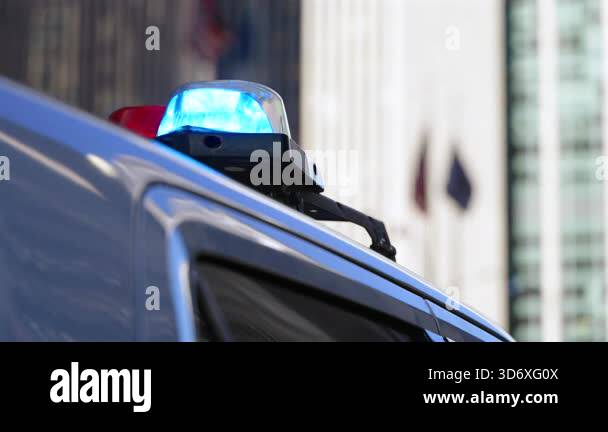 Closeup view of police emergency light mounted on a vehicle roof with ...