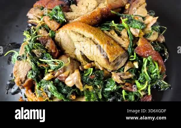 Stir-fried roasted duck with basil in plate, Thai famous food Stock ...
